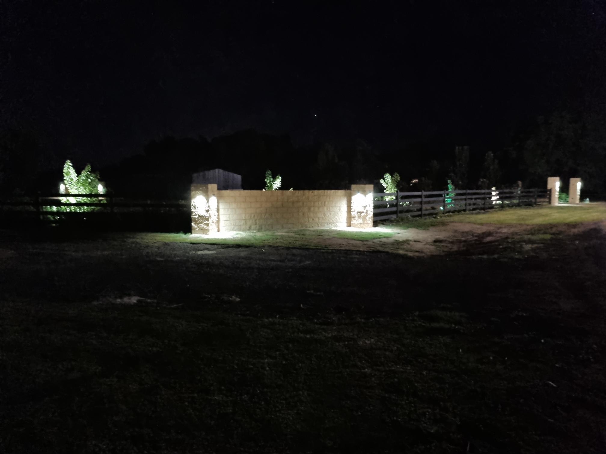A Visual Journey: Premium Steel Fencing in Daylight and Darkness